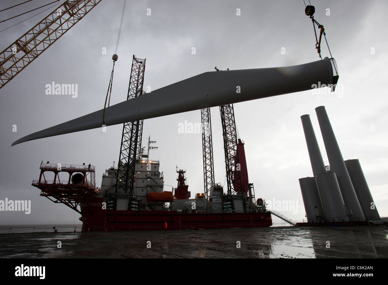 A jack up barge at Mostyn port and wind turbine parts Stock Photo - Alamy