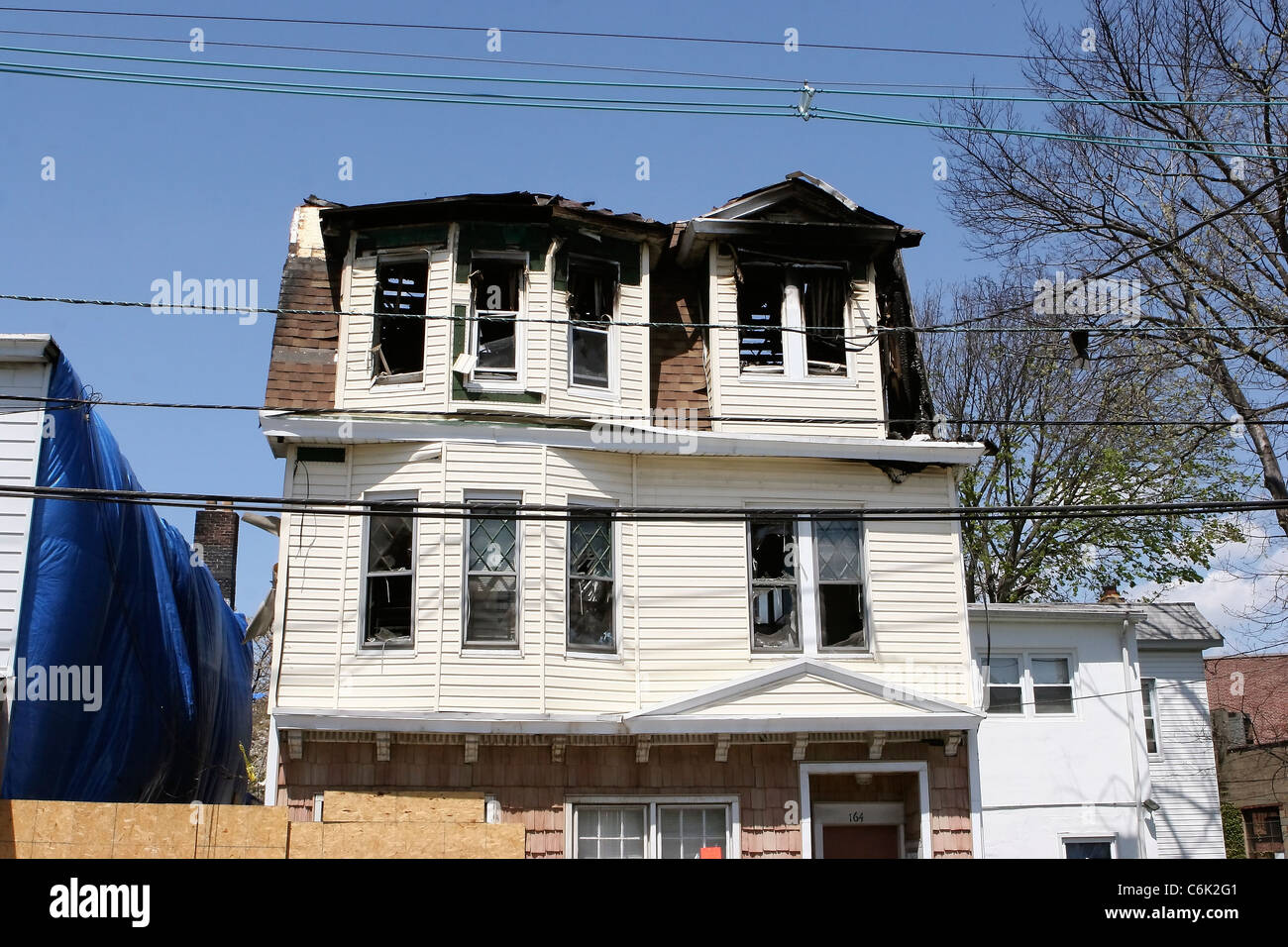 Timber frame home damaged by fire Stock Photo - Alamy