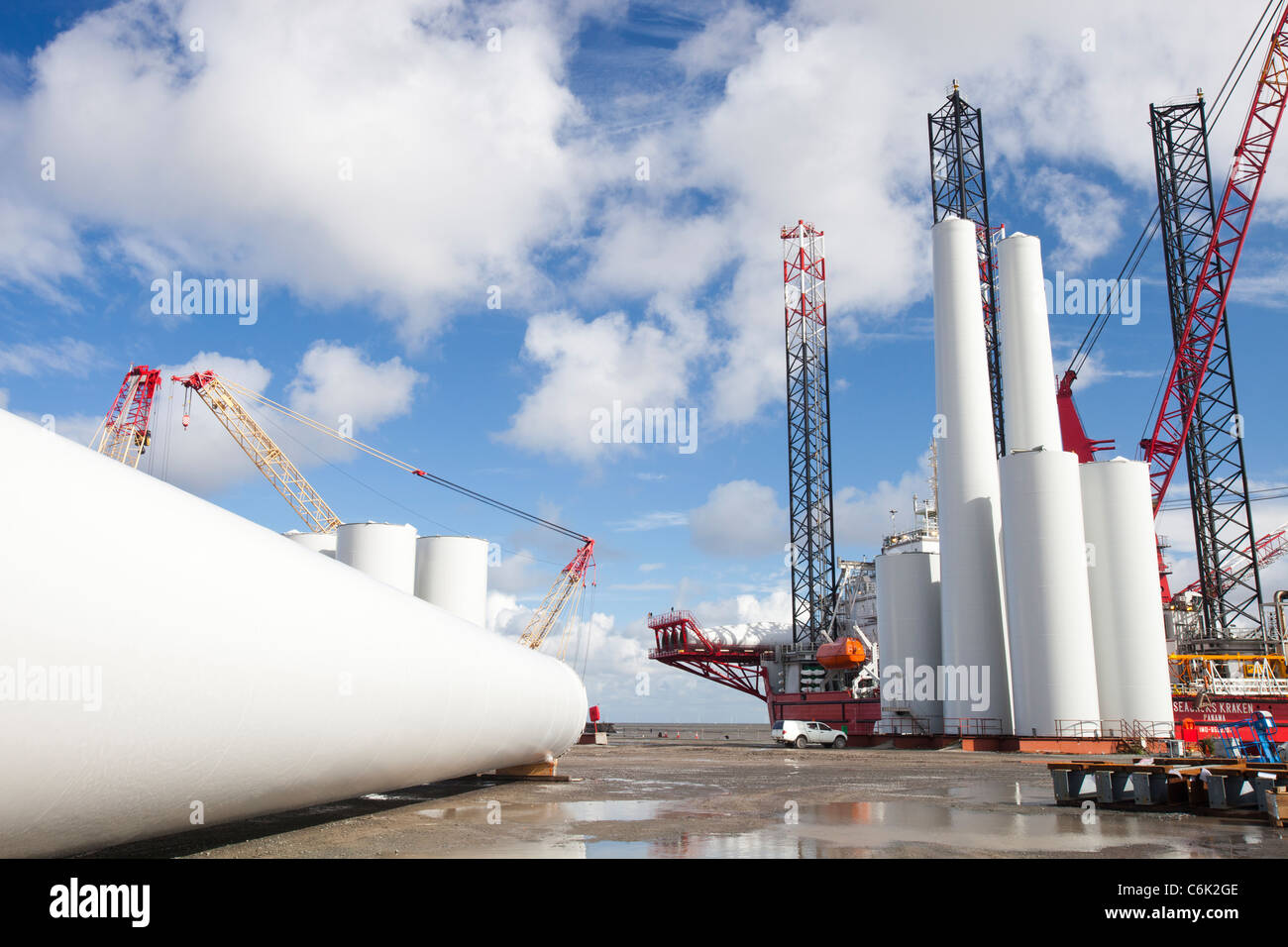 A jack up barge at Mostyn port and wind turbine parts Stock Photo - Alamy