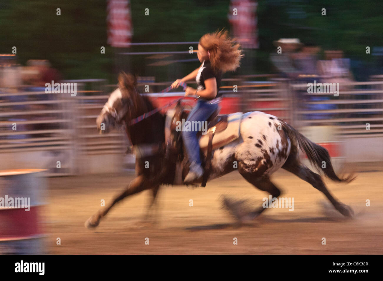 Horse and rider at barrel racing contest Stock Photo - Alamy
