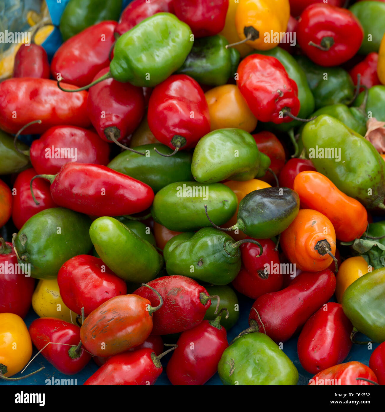 Chili pepper for sale at a market stall in Pisac, Sacred Valley, Cusco ...