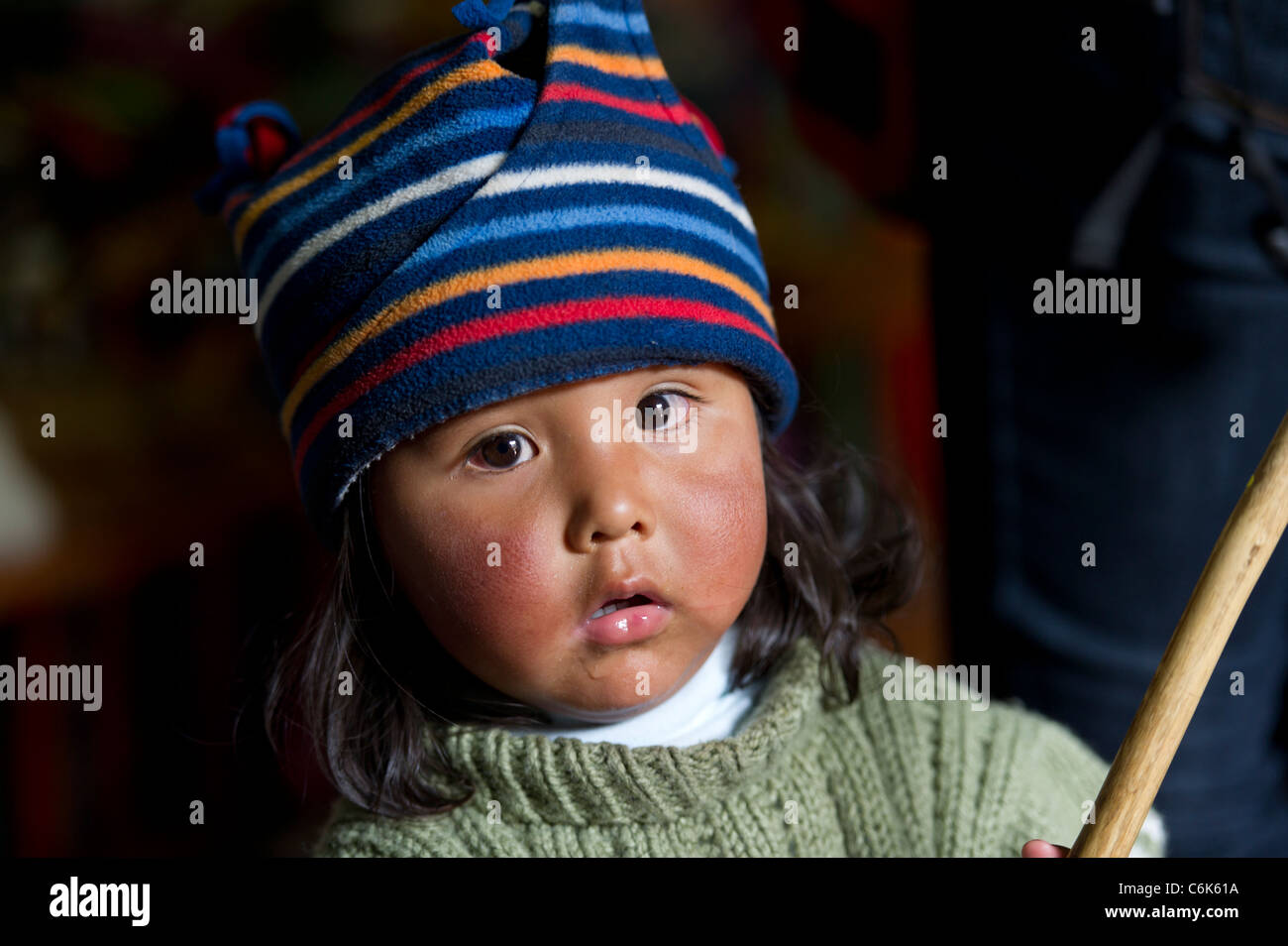 Portrait of a girl wearing a knit hat, Barrio de San Blas, Cuzco, Peru ...