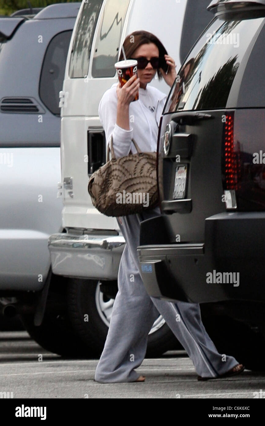 Victoria Beckham returning to the car after taking her kids to see the ...