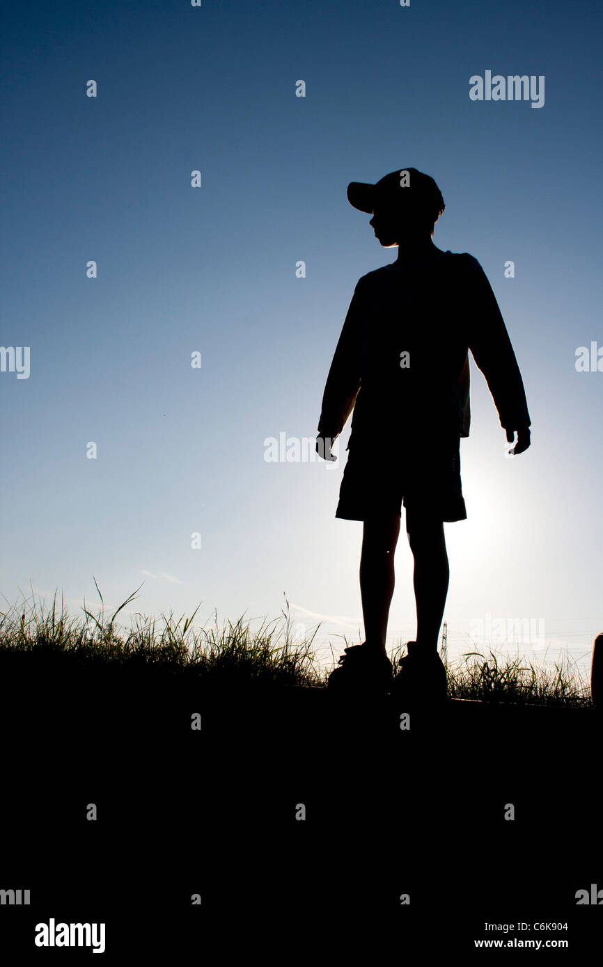 Boy at sunset Stock Photo - Alamy
