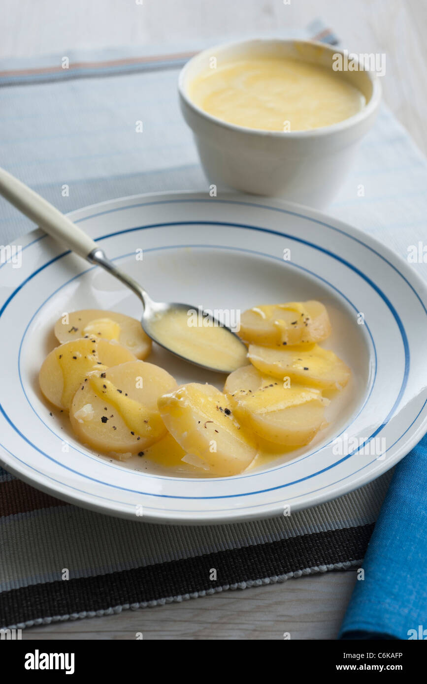 Aioli served with sliced potatoes Stock Photo - Alamy