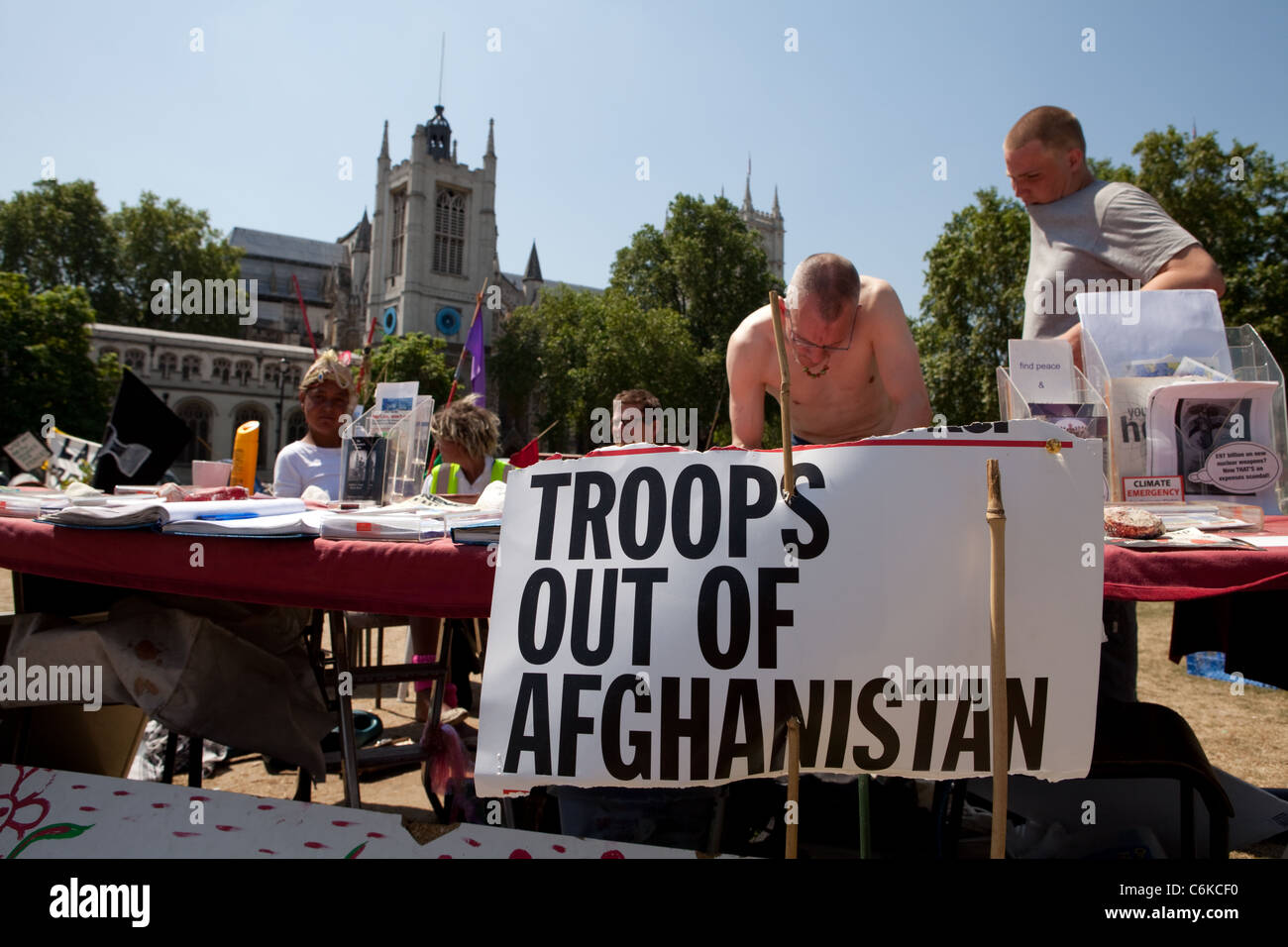 The welcome desk at Democracy Village, with a banner and pamphlets ...