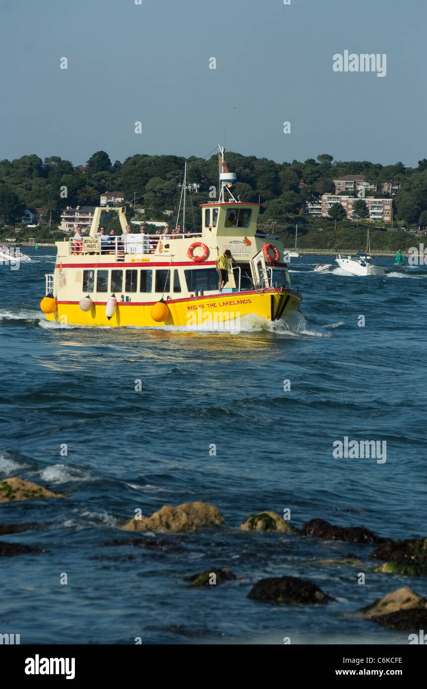 Yellow ferry boats from Poole Harbour to Brownsea Island in Dorset ...