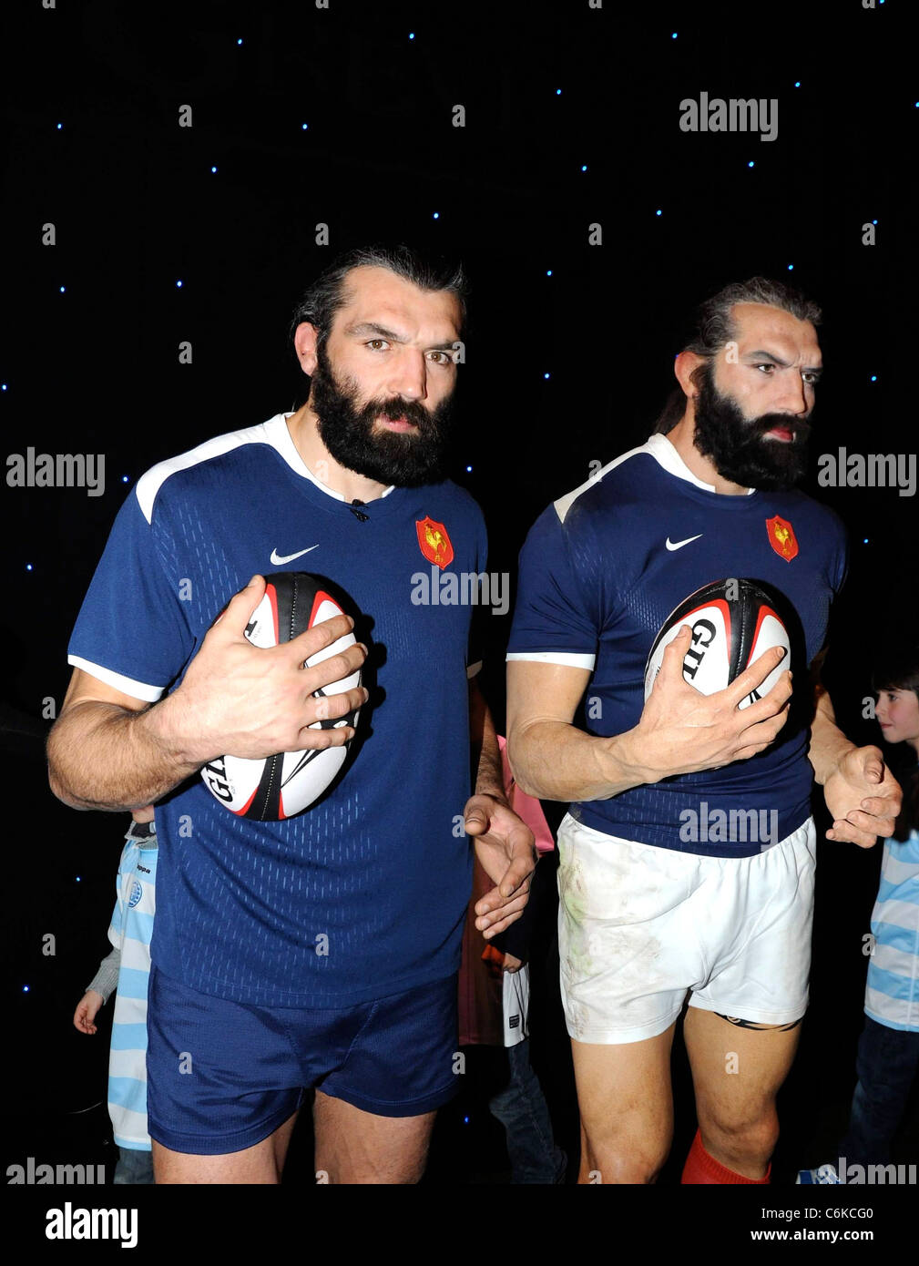 French rugby union player Sebastien Chabal poses next to his wax ...