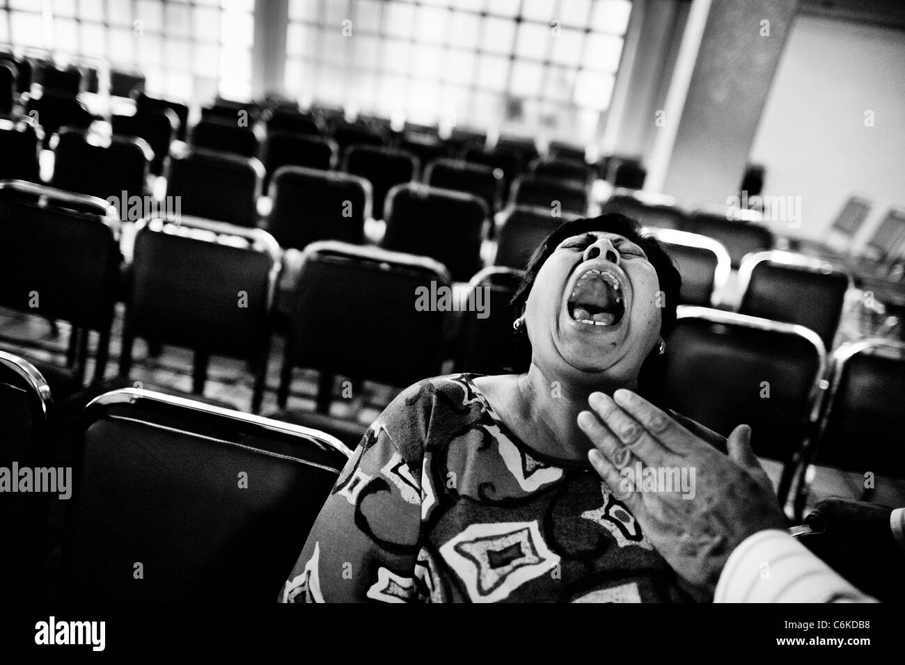 A Mexican woman yells desperately during the exorcism rite performed at ...
