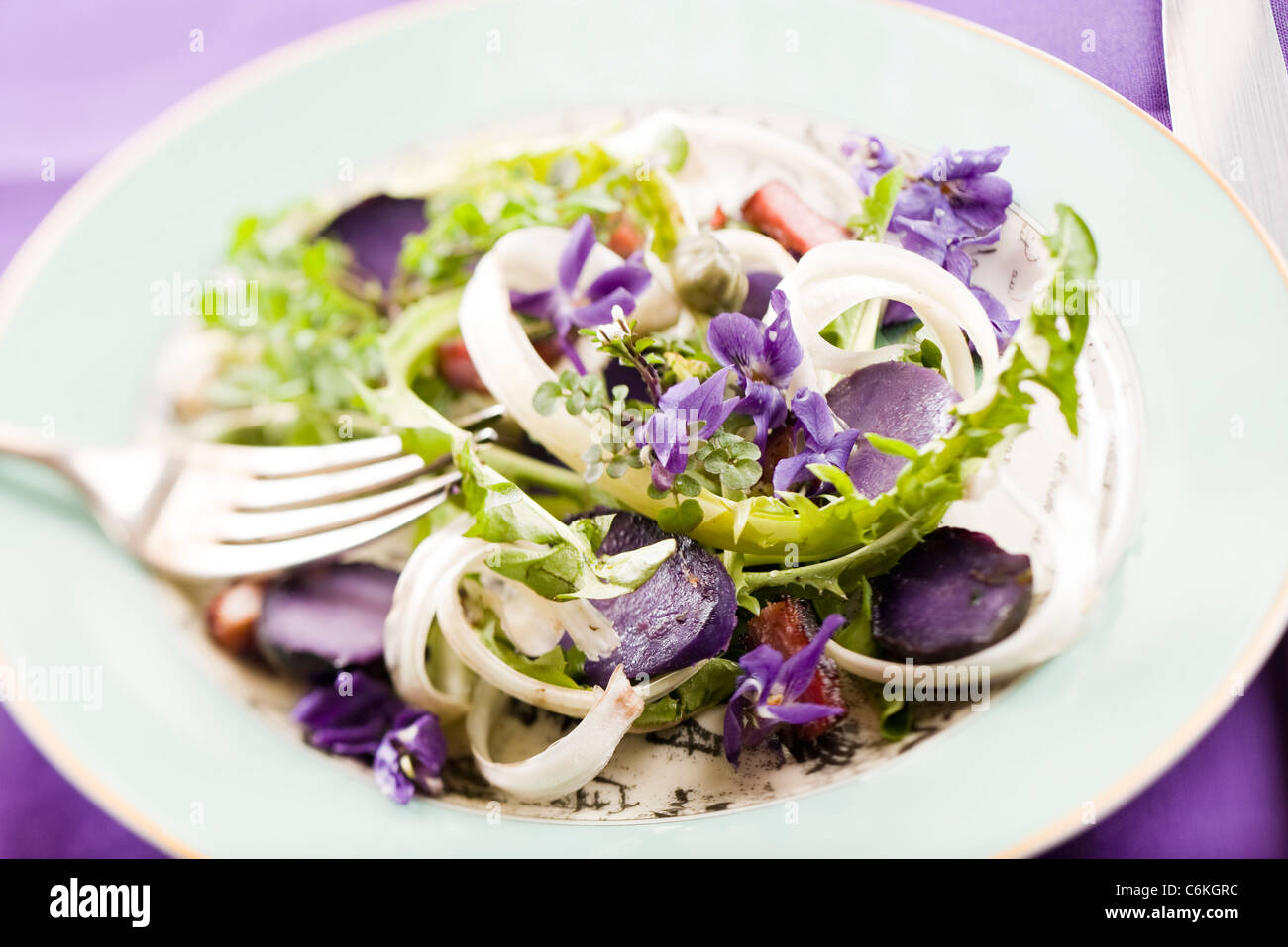 Dandelion and violet salad Stock Photo - Alamy
