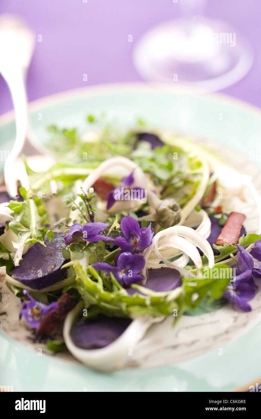 Dandelion and violet salad Stock Photo - Alamy