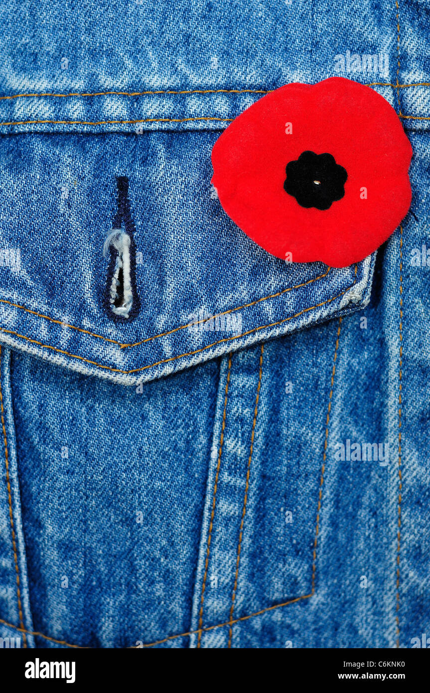 Remembrance Day Poppy Being Worn On A Denim Jacket Stock Photo - Alamy