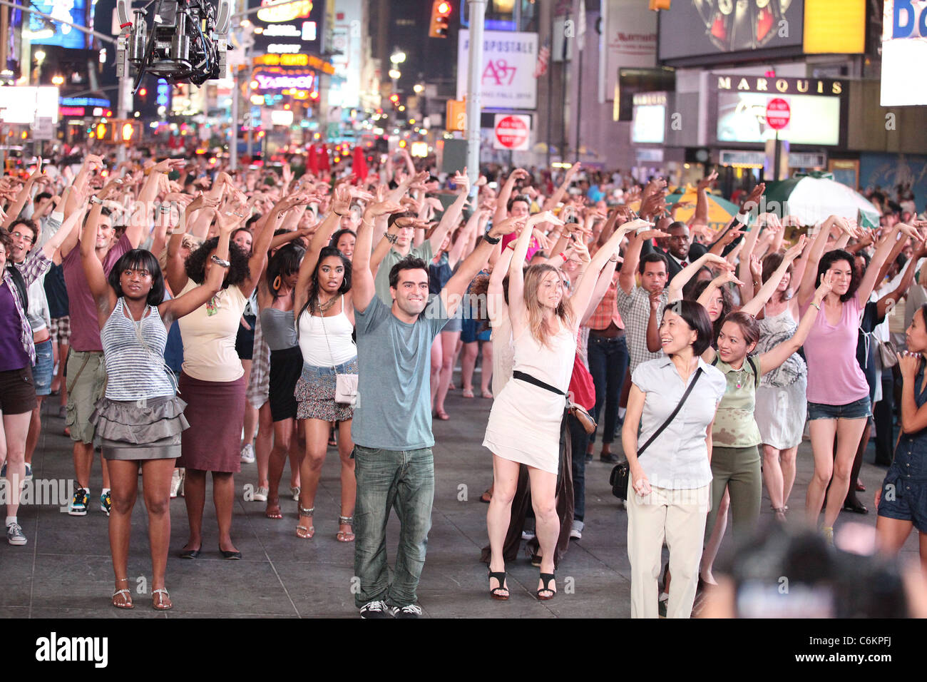 The cast of 'Friends With Benefits' filming in Times Square New York ...