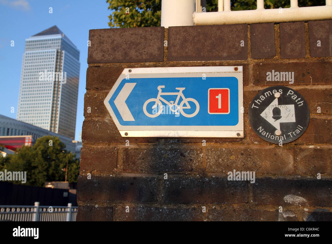Thames Path and cycleway route 1 sign on Canary Wharf, London, UK Stock ...