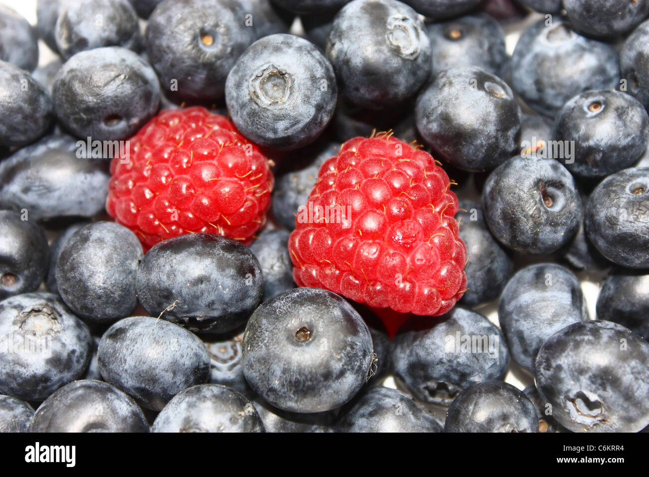 black blueberries with red raspberries, background Stock Photo - Alamy