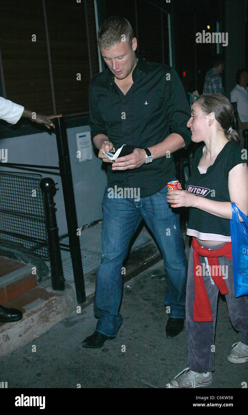 Andrew Flintoff, aka Freddie Flintoff, hands over a twenty pound note ...