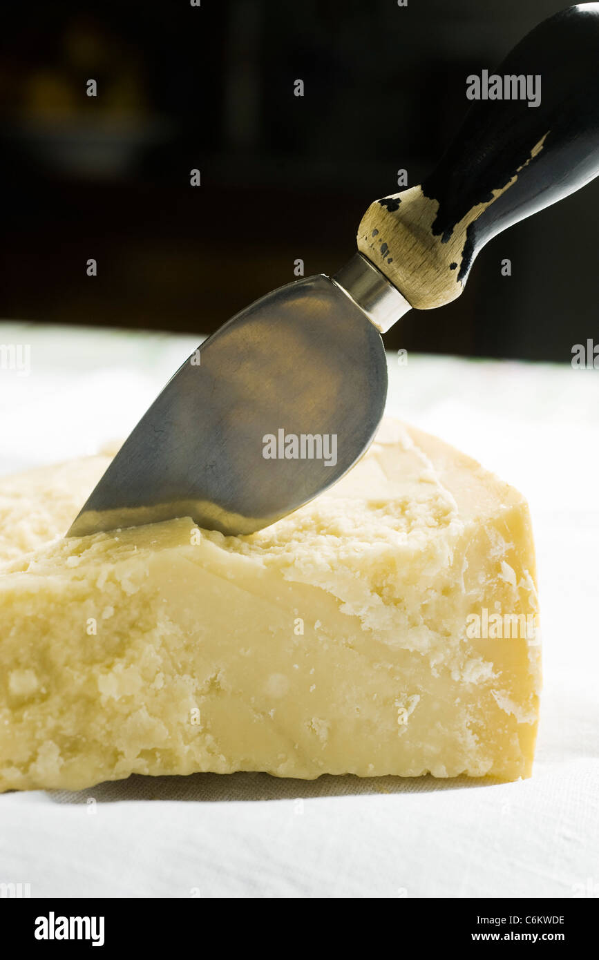 Parmesan cheese and cheese knife Stock Photo - Alamy