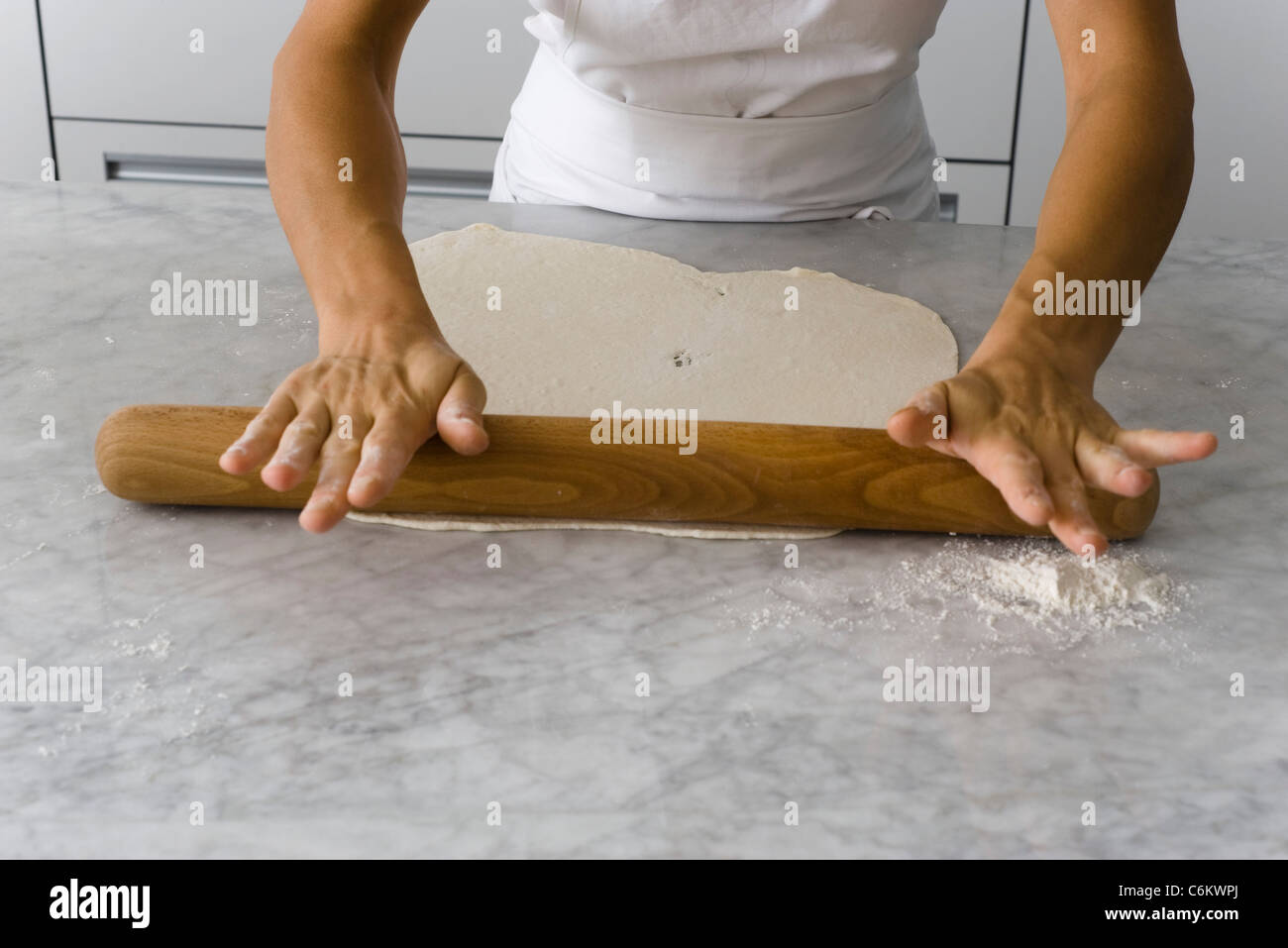 Rolling out bread dough Stock Photo - Alamy