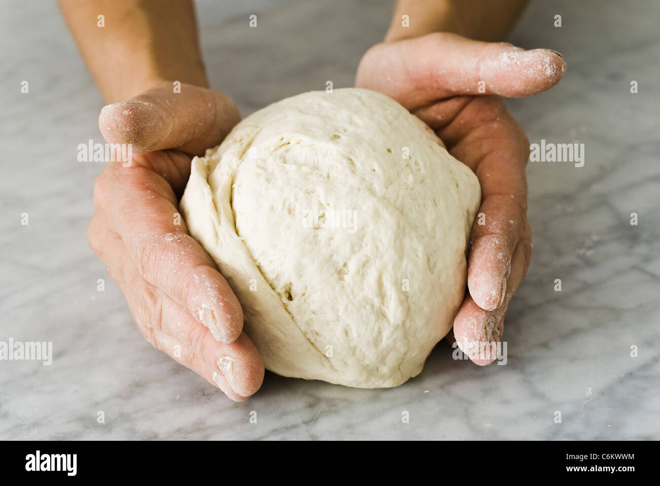 Forming basic bread dough into a ball Stock Photo - Alamy