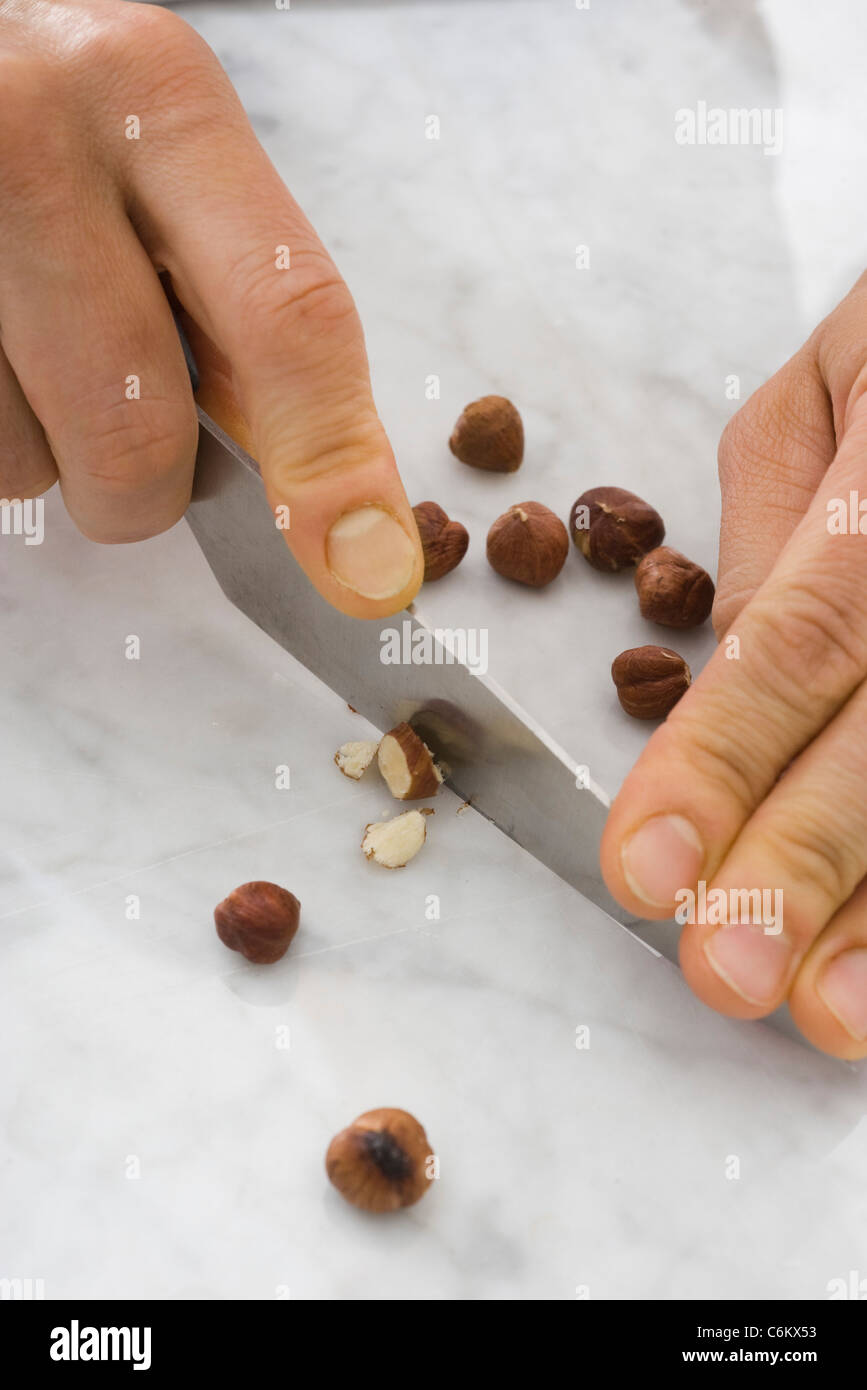 Crushing nuts hi-res stock photography and images - Alamy