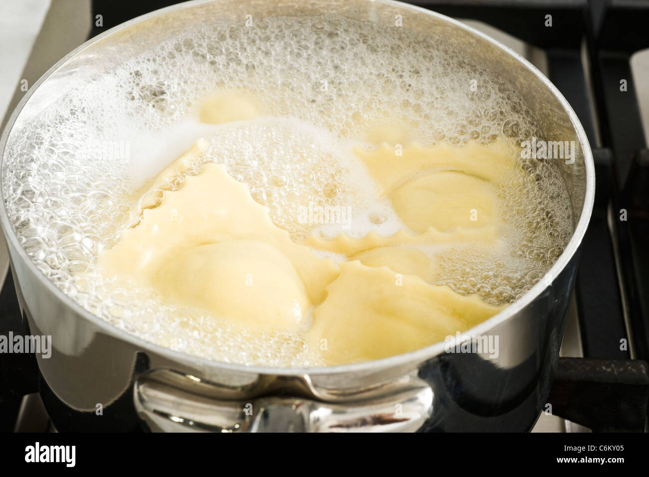 Boiling ravioli in salted water Stock Photo - Alamy