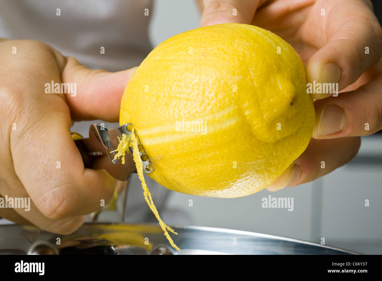 Zesting a lemon Stock Photo - Alamy