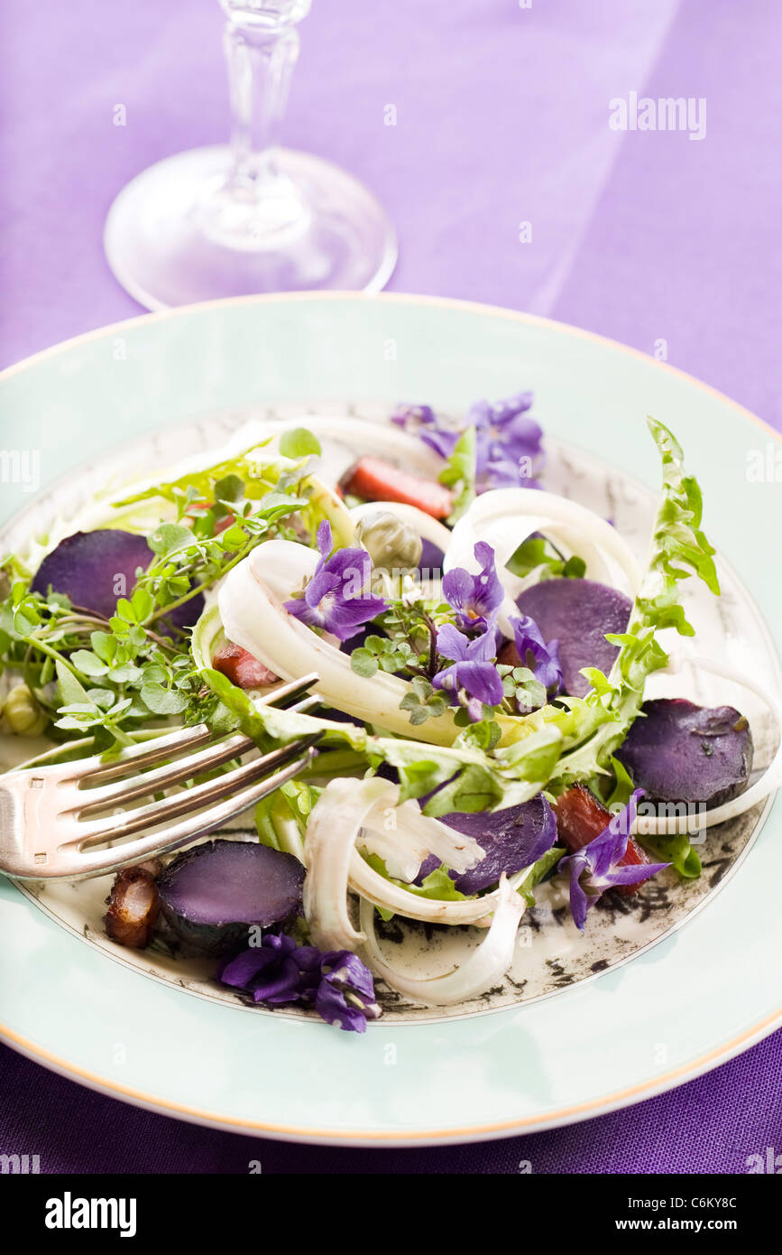 Dandelion and violet salad Stock Photo - Alamy