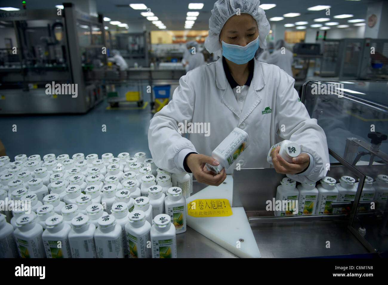Assemble line of Amway Nutrilite in Amway Guangzhou Factory Stock Photo ...