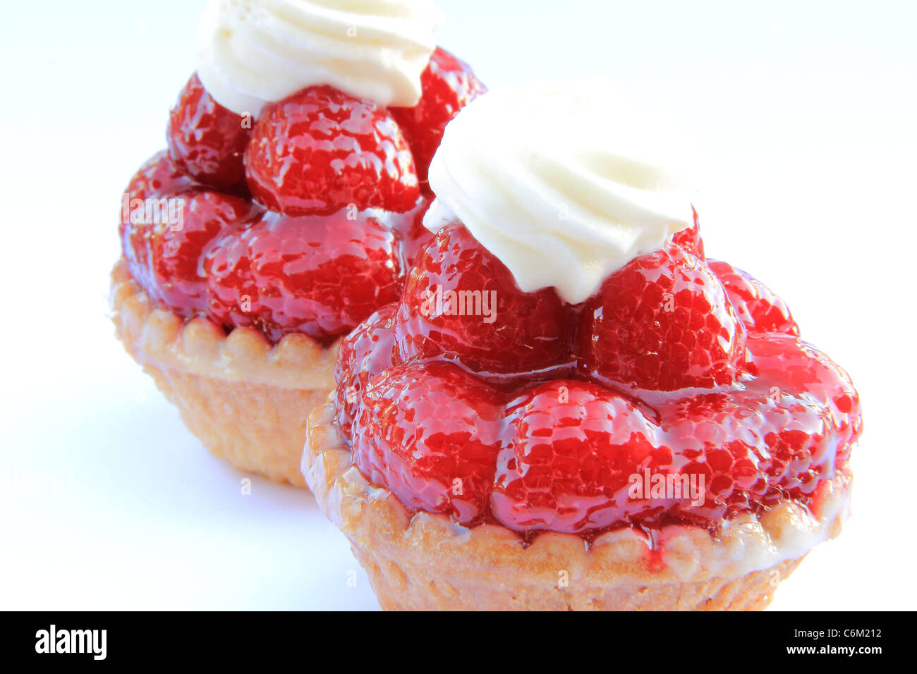 two raspberry tartlets with custard and chantilly Stock Photo - Alamy