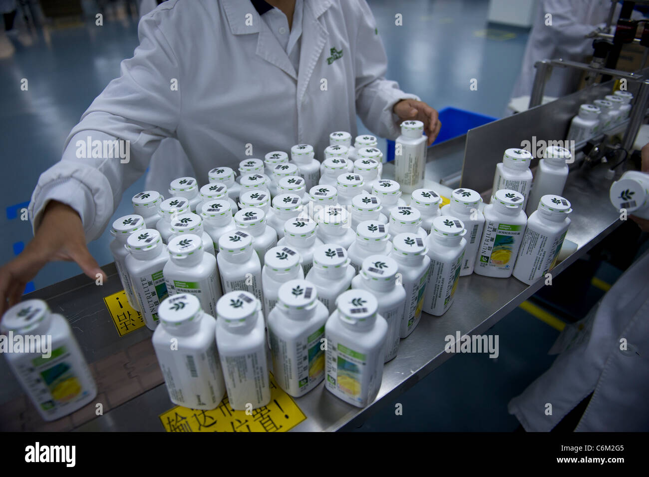 Assemble line of Amway Nutrilite in Amway Guangzhou Factory Stock Photo ...