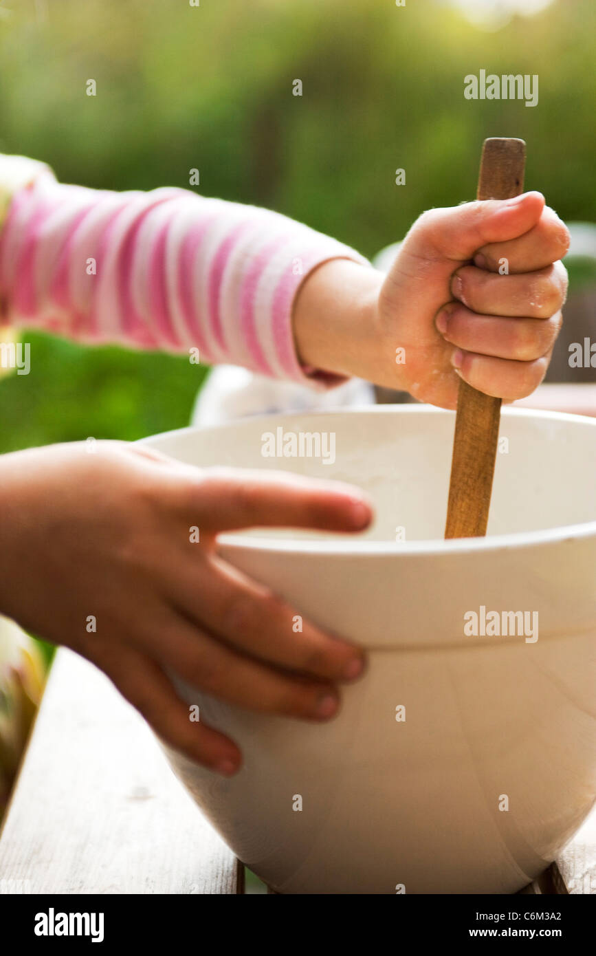 Using mixing bowl Stock Photo - Alamy