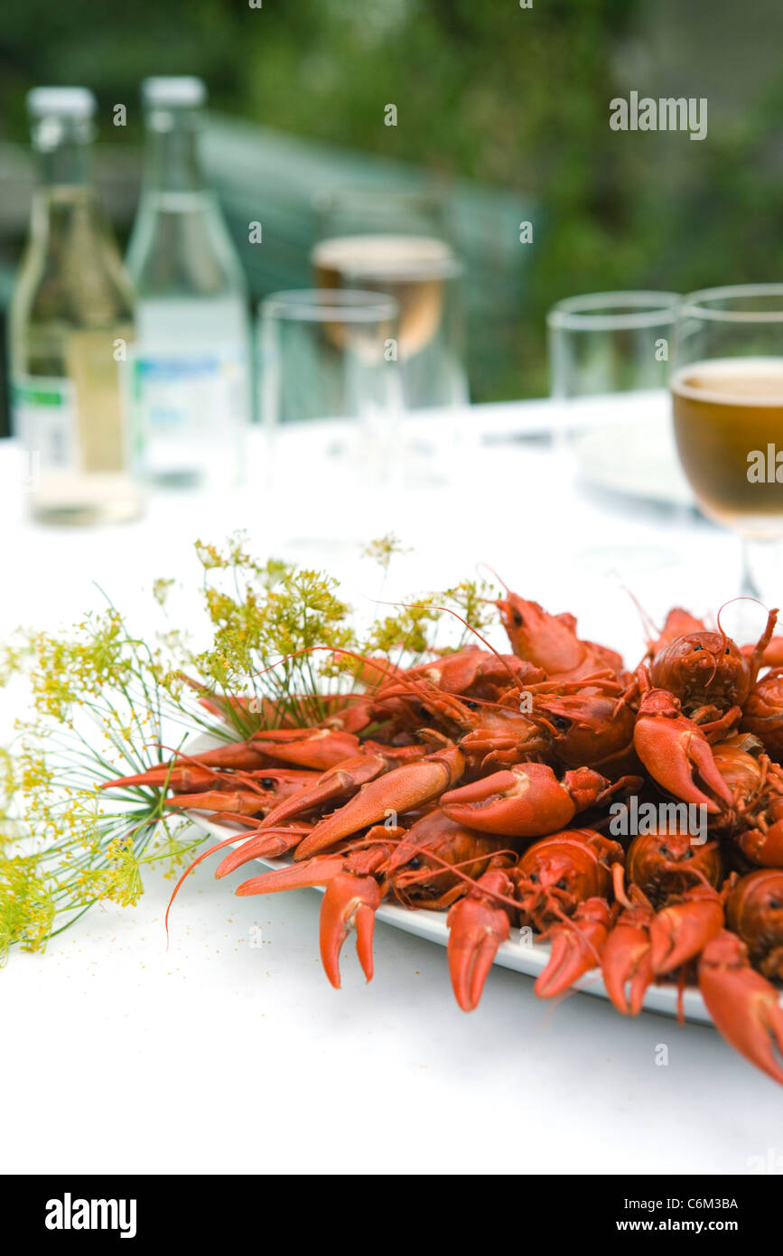 Boiled crawfish on outdoor dinner table Stock Photo - Alamy