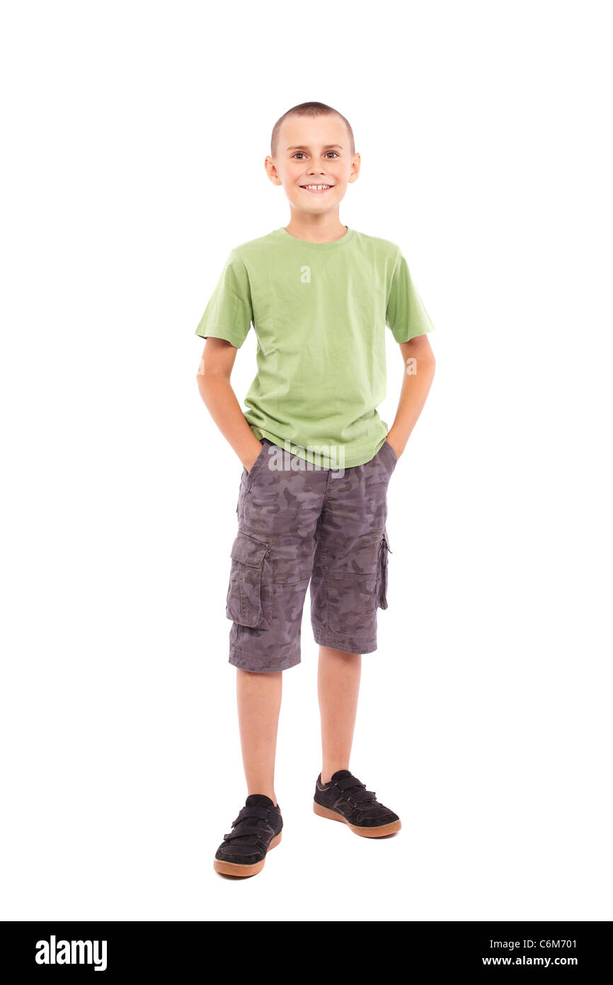Full length portrait of a child standing, isolated on white background ...