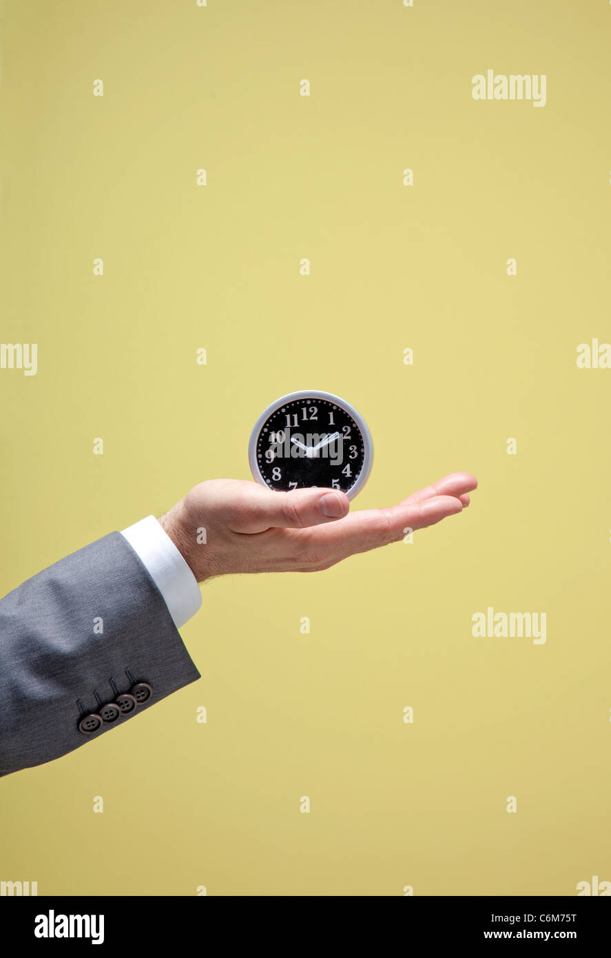 Hand and clock hi-res stock photography and images - Alamy