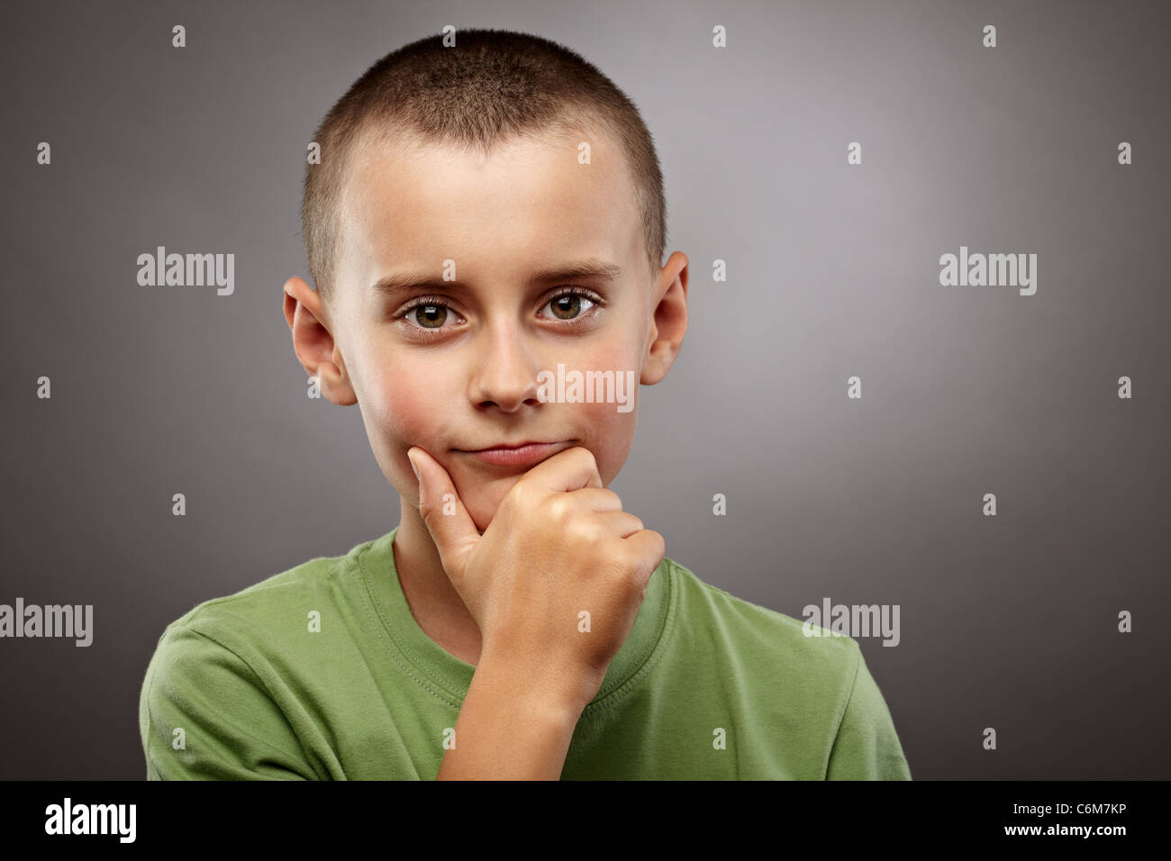 Studio closeup portrait of a pensive child Stock Photo - Alamy