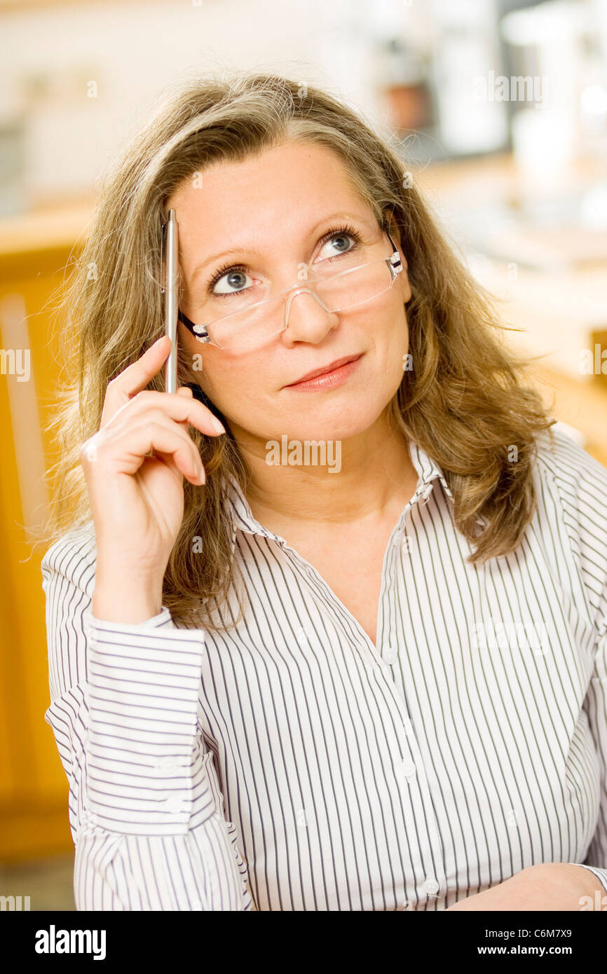 Female 50 thoughtfully hi-res stock photography and images - Alamy
