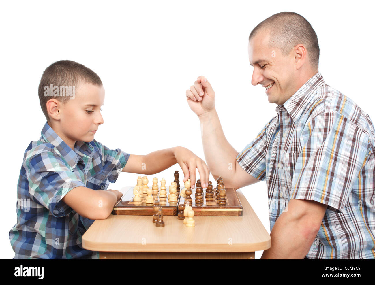 Father and son playing chess, isolated on white background Stock Photo ...