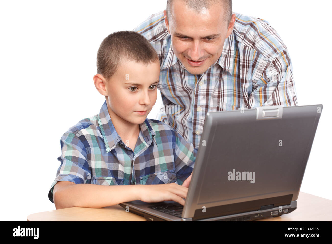 Father and son at the laptop, isolated on white background Stock Photo ...