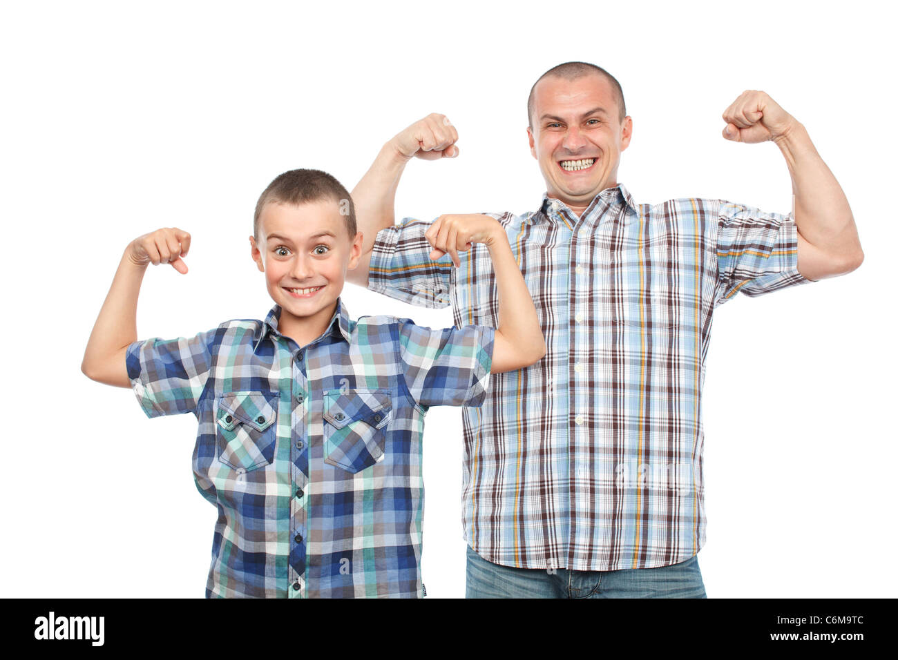 Proud father and son showing their strength, isolated on white ...