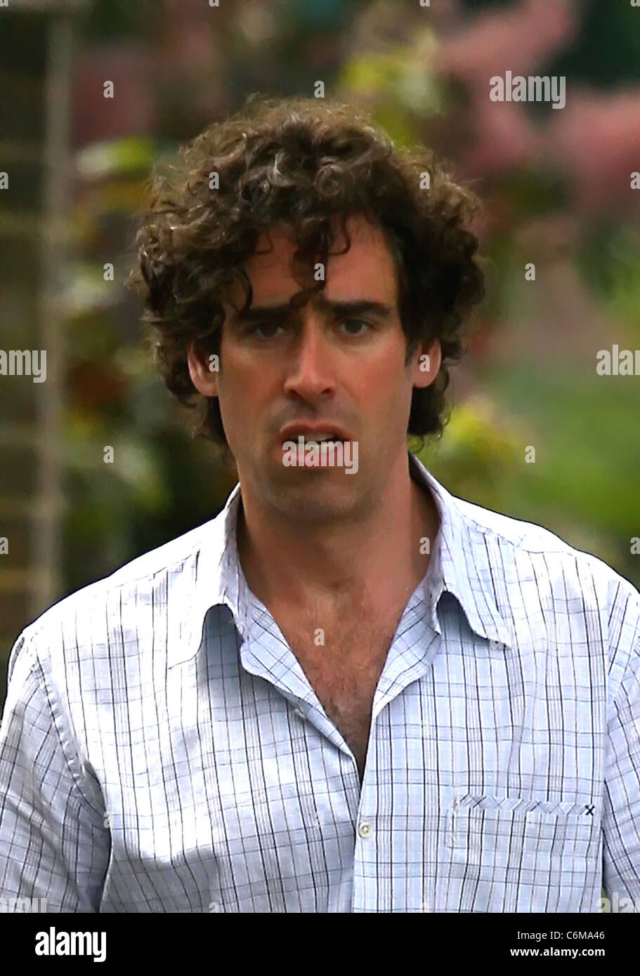 Comedy actor Stephen Mangan walking with a shopping bag in North London ...
