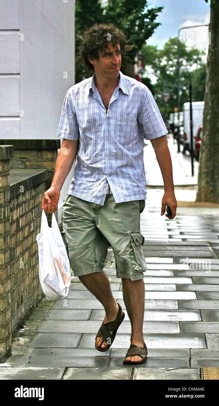 Comedy actor Stephen Mangan walking with a shopping bag in North London ...