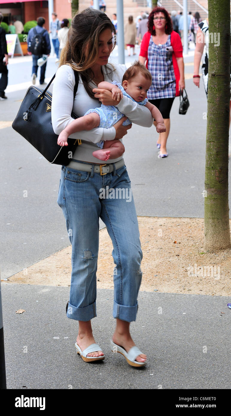 Carly Zucker, with her daughter Ruby Cole, out shopping following her footballer husband's move ...