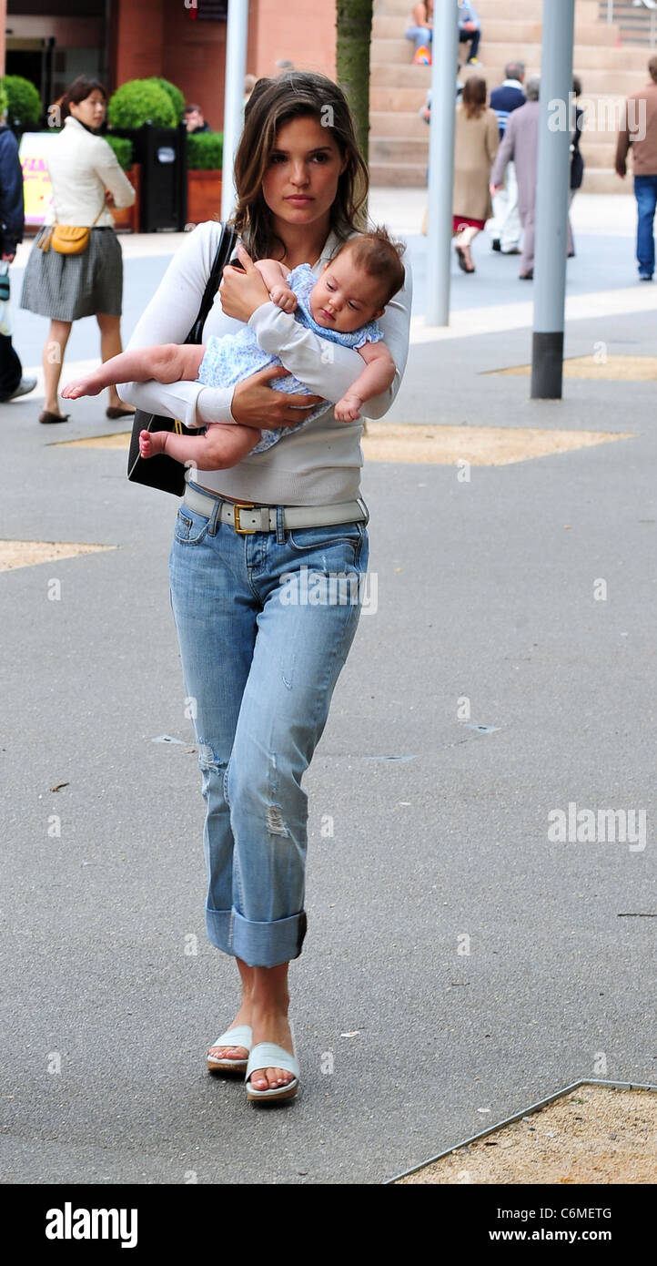 Carly Zucker, with her daughter Ruby Cole, out shopping following her footballer husband's move ...