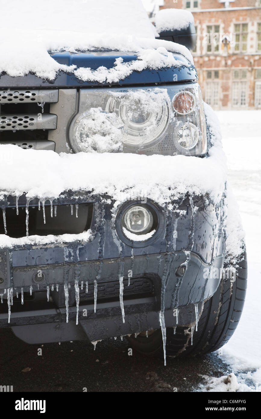 Closeup of a land rover covered in snow and ice. Ideal to depict ...