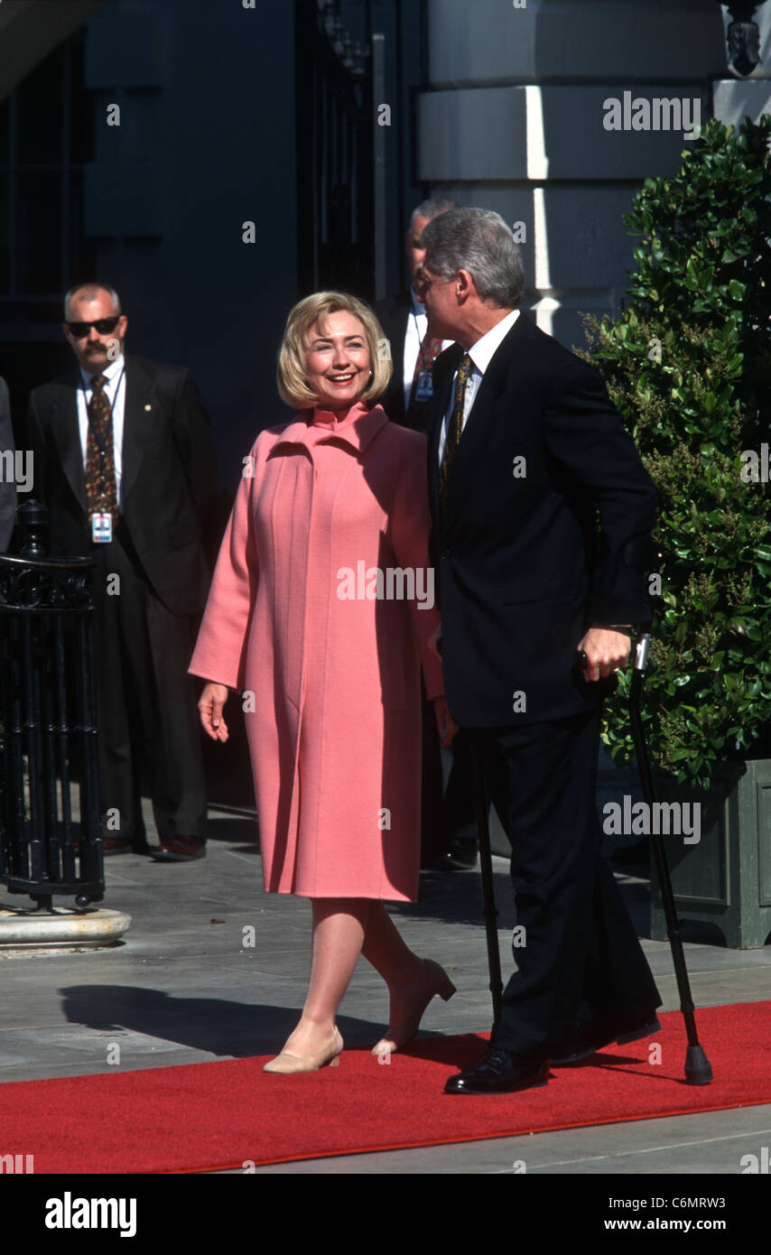 President Bill Clinton crutches braces Hillary First Lady pink coat ...
