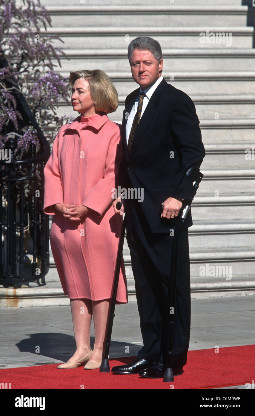 President Bill Clinton crutches braces Hillary First Lady pink coat ...