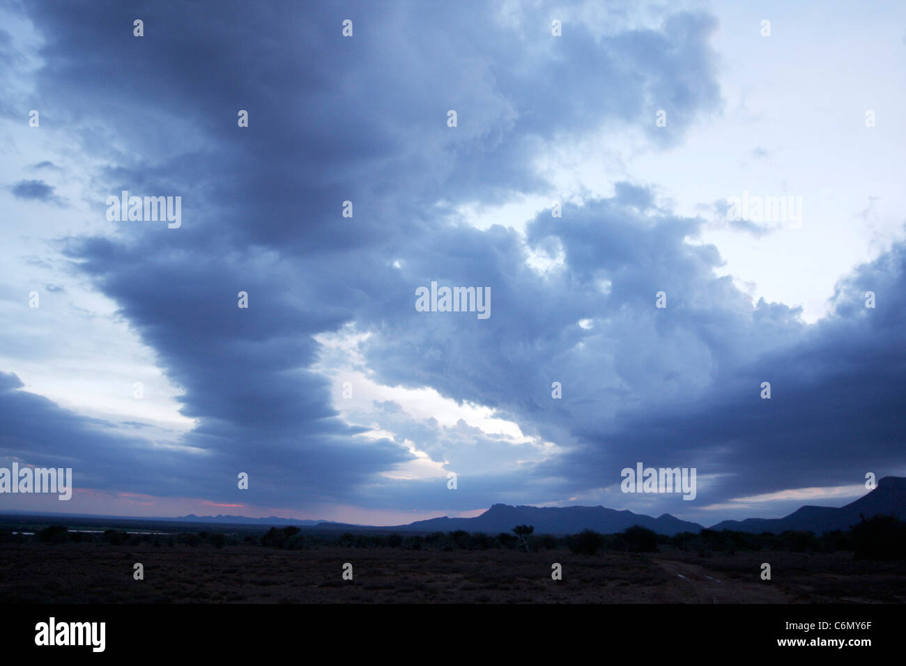 Mountain range and storm clouds overhead Stock Photo - Alamy