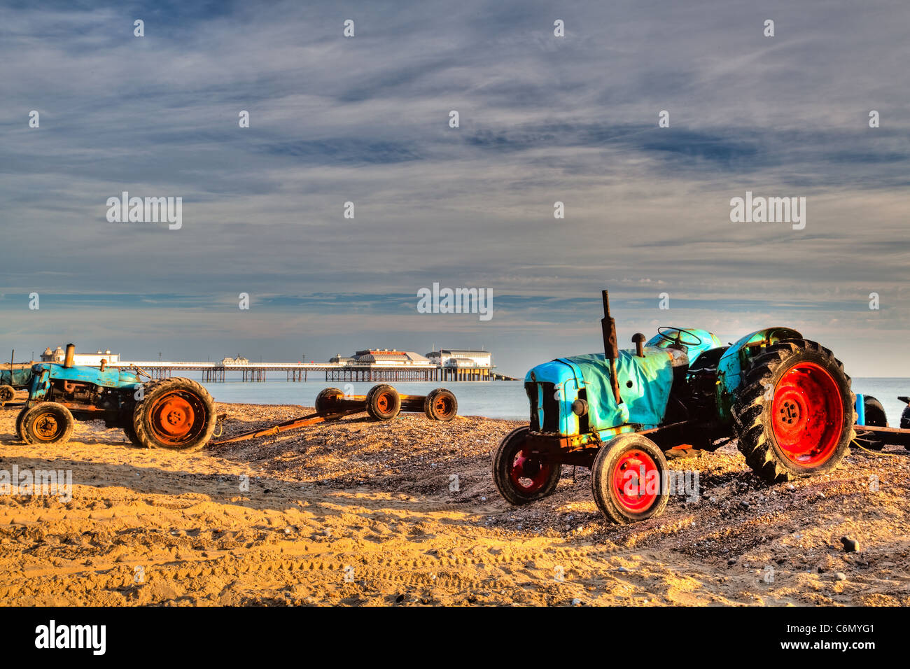 Tractor at Cromer beach in Great Britain Stock Photo - Alamy