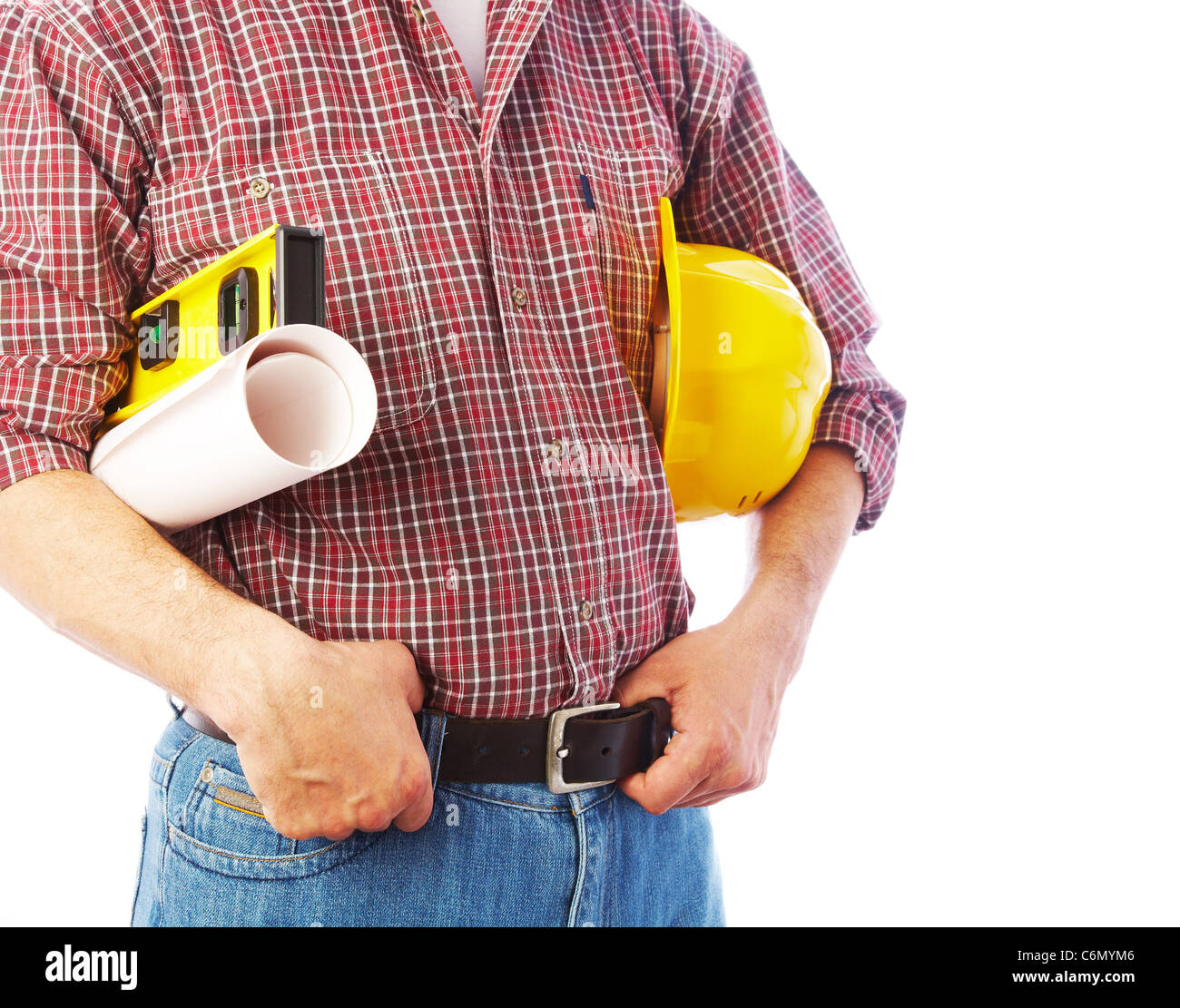 Close-up unrecognizable builder with the tools and a helmet under his ...