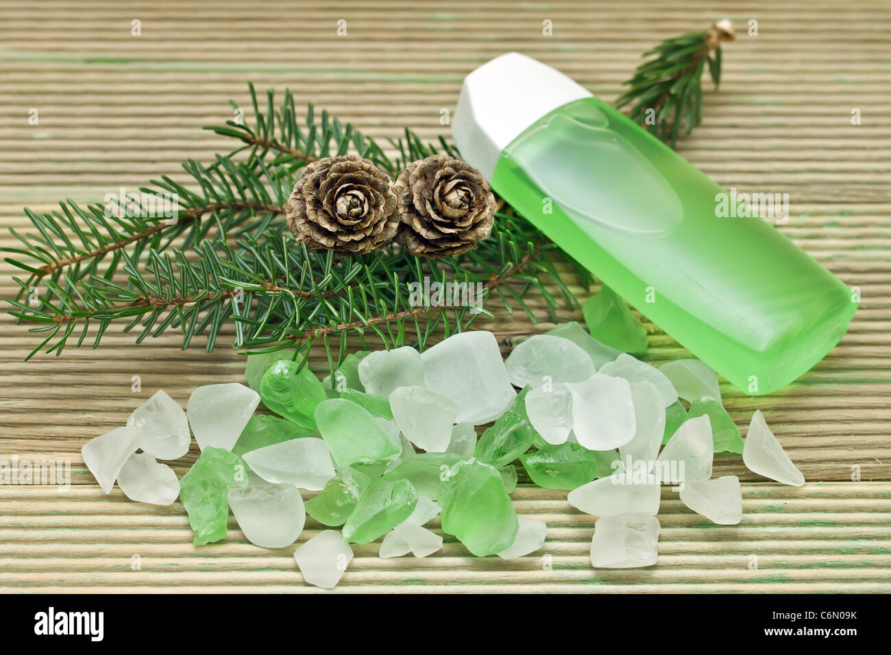 Coniferous extract bath with a sprig of pine needles, pine cones and ...